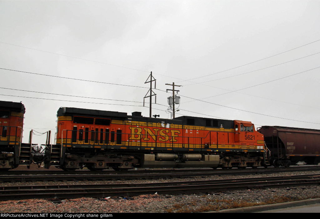 BNSF 5621 trails 3rd unit on a grain train.
